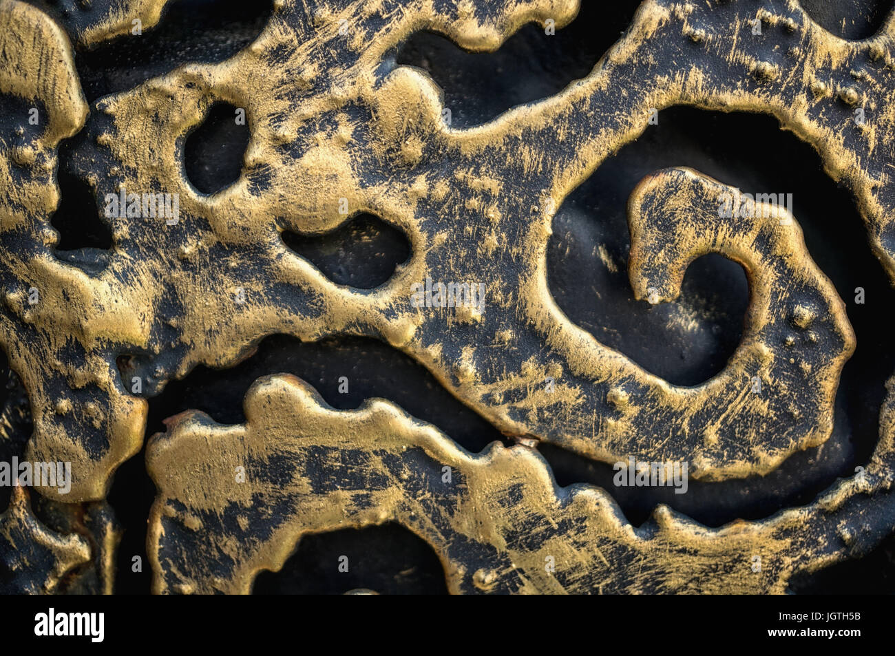 Gold metal texture background with forged pattern. Close-up. The ...