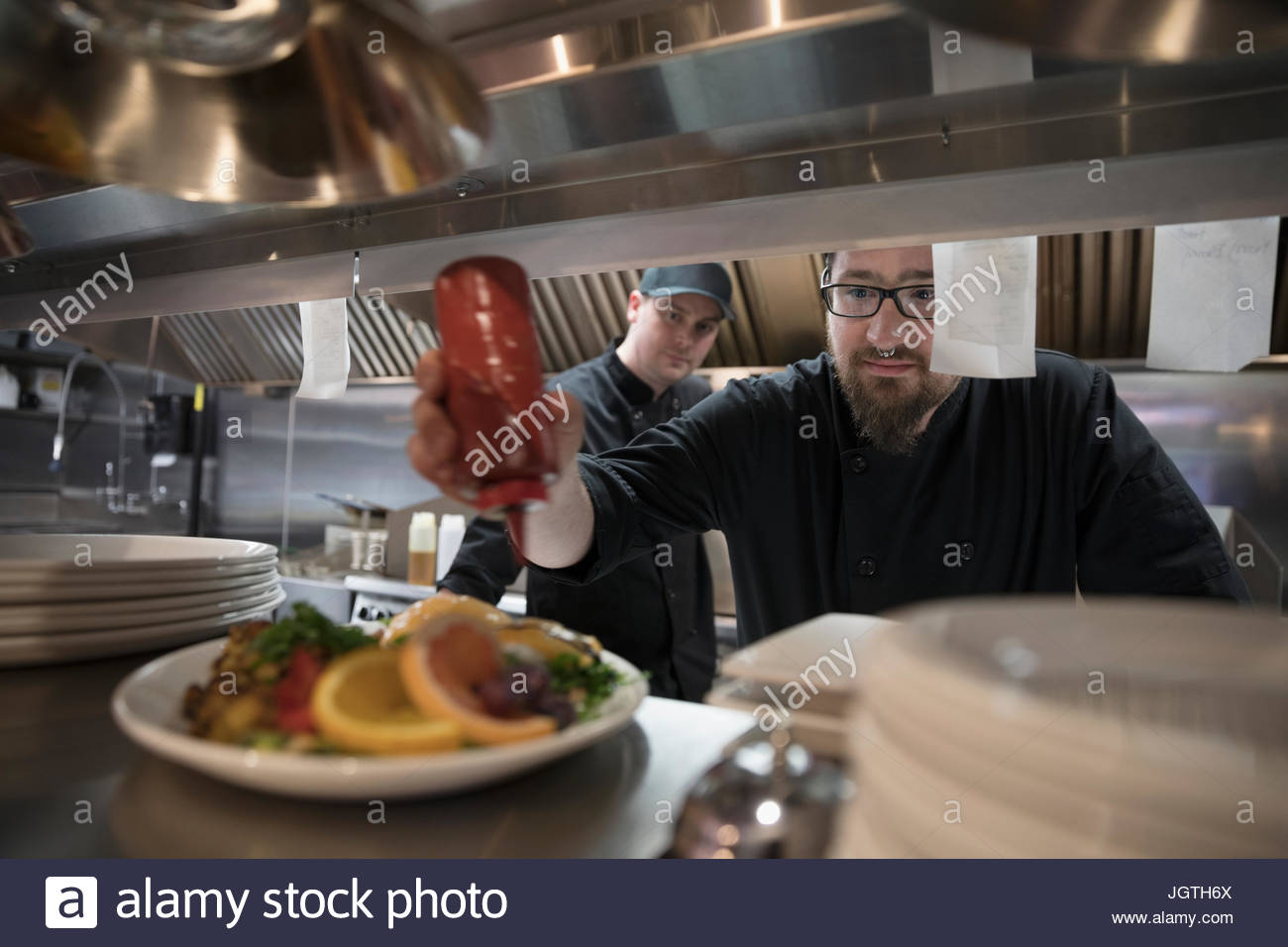 Standing holding food and drink preparation looking down hi-res stock ...