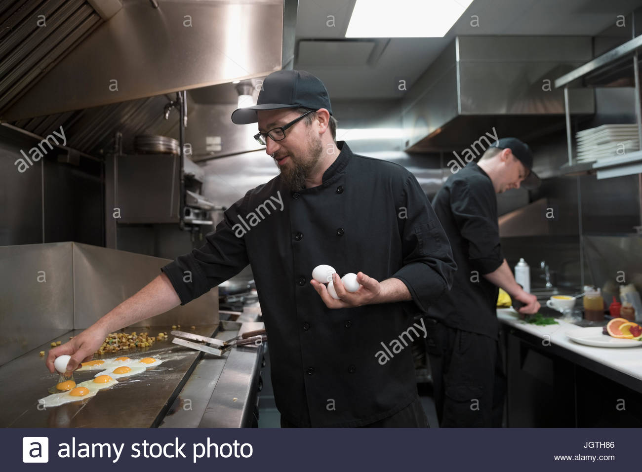 Cook preparing hi-res stock photography and images - Alamy