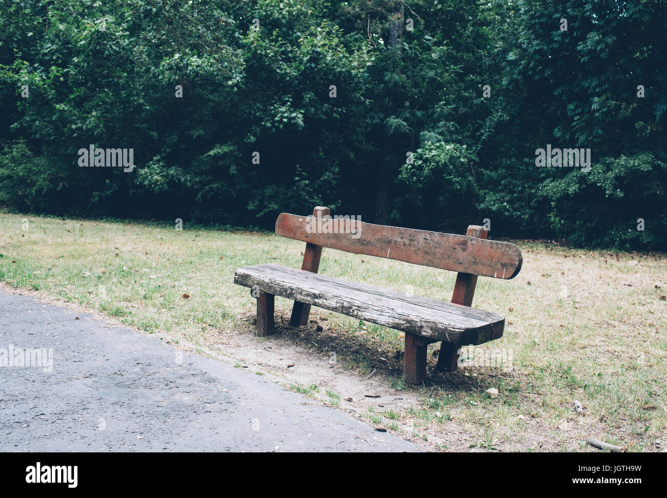 old wooden bench in an abandoned city park Stock Photo - Alamy