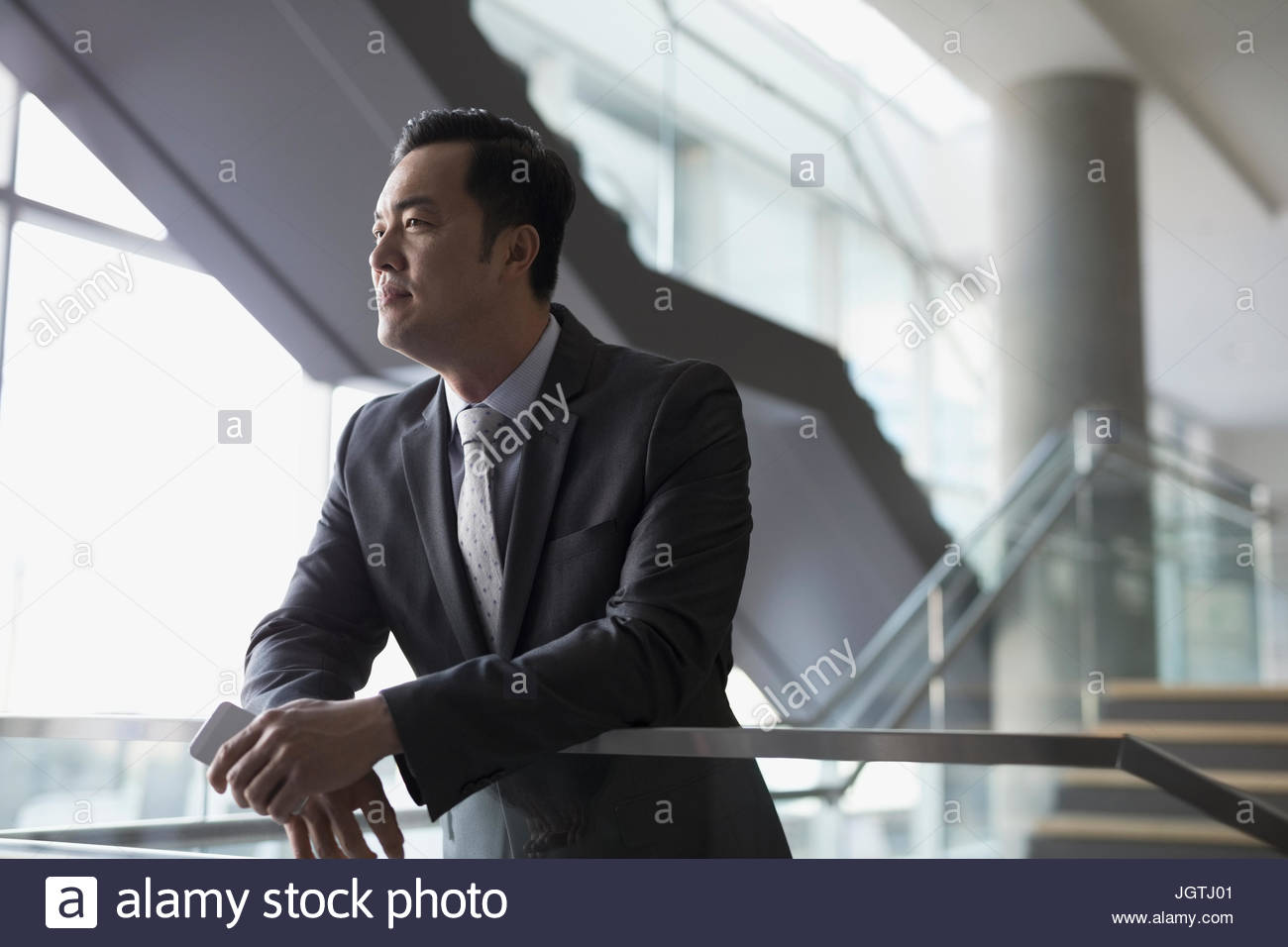 Man leaning on a railing hi-res stock photography and images - Alamy