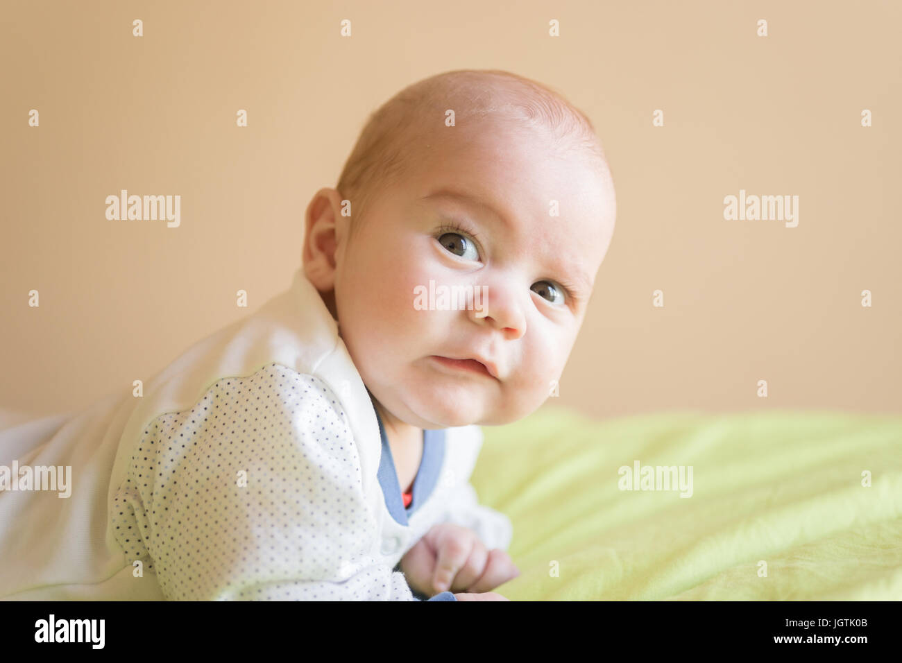Portrait of a four-month boy. First time that raises its head Stock ...