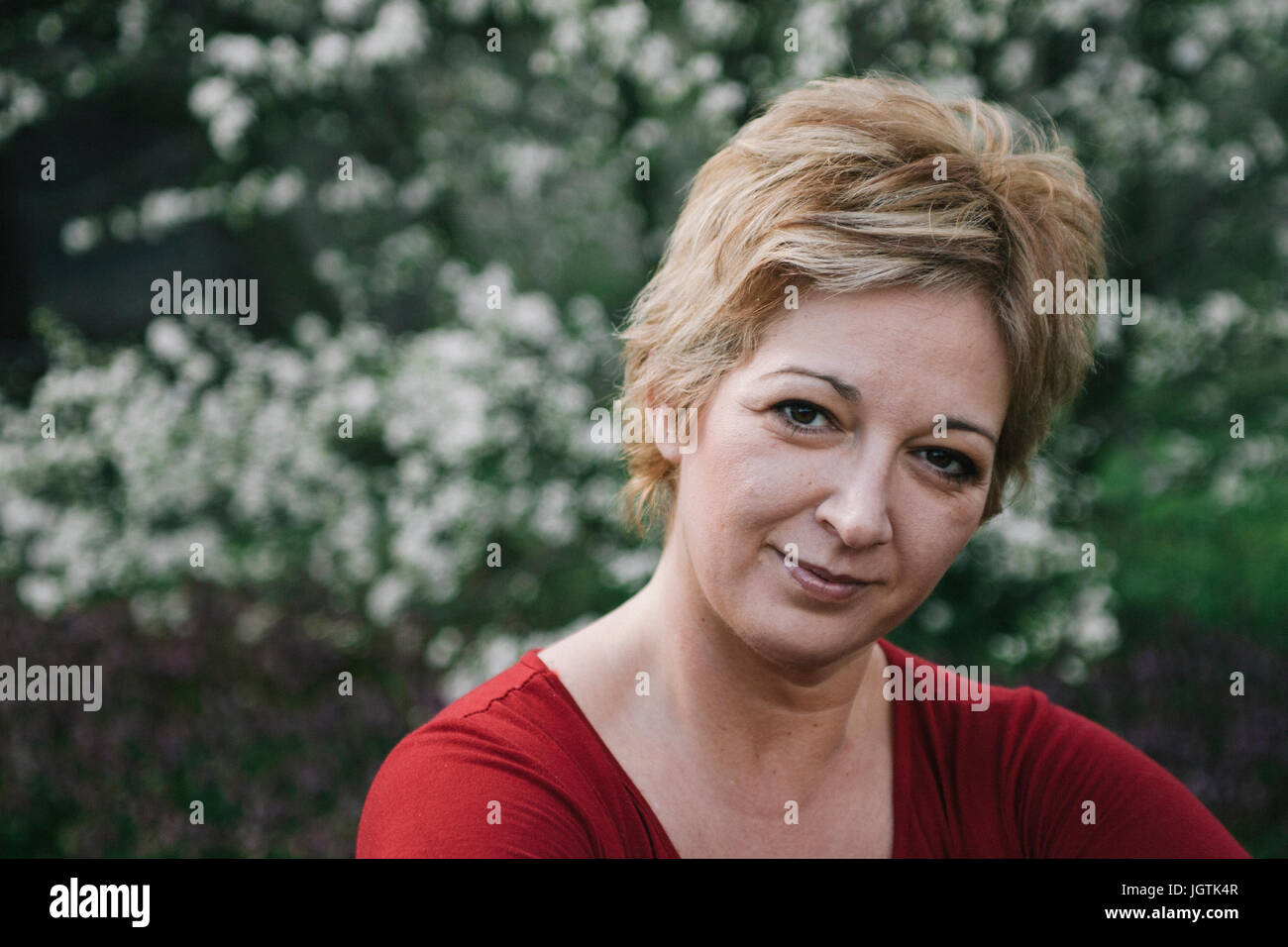 Natural 40 years old blonde woman outdoors at spring Stock Photo - Alamy