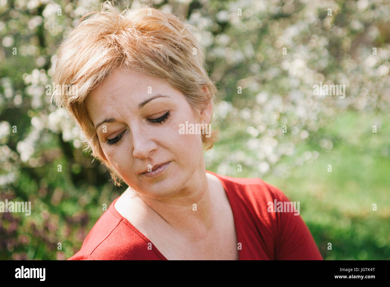 Natural 40 years old blonde woman outdoors at spring Stock Photo - Alamy