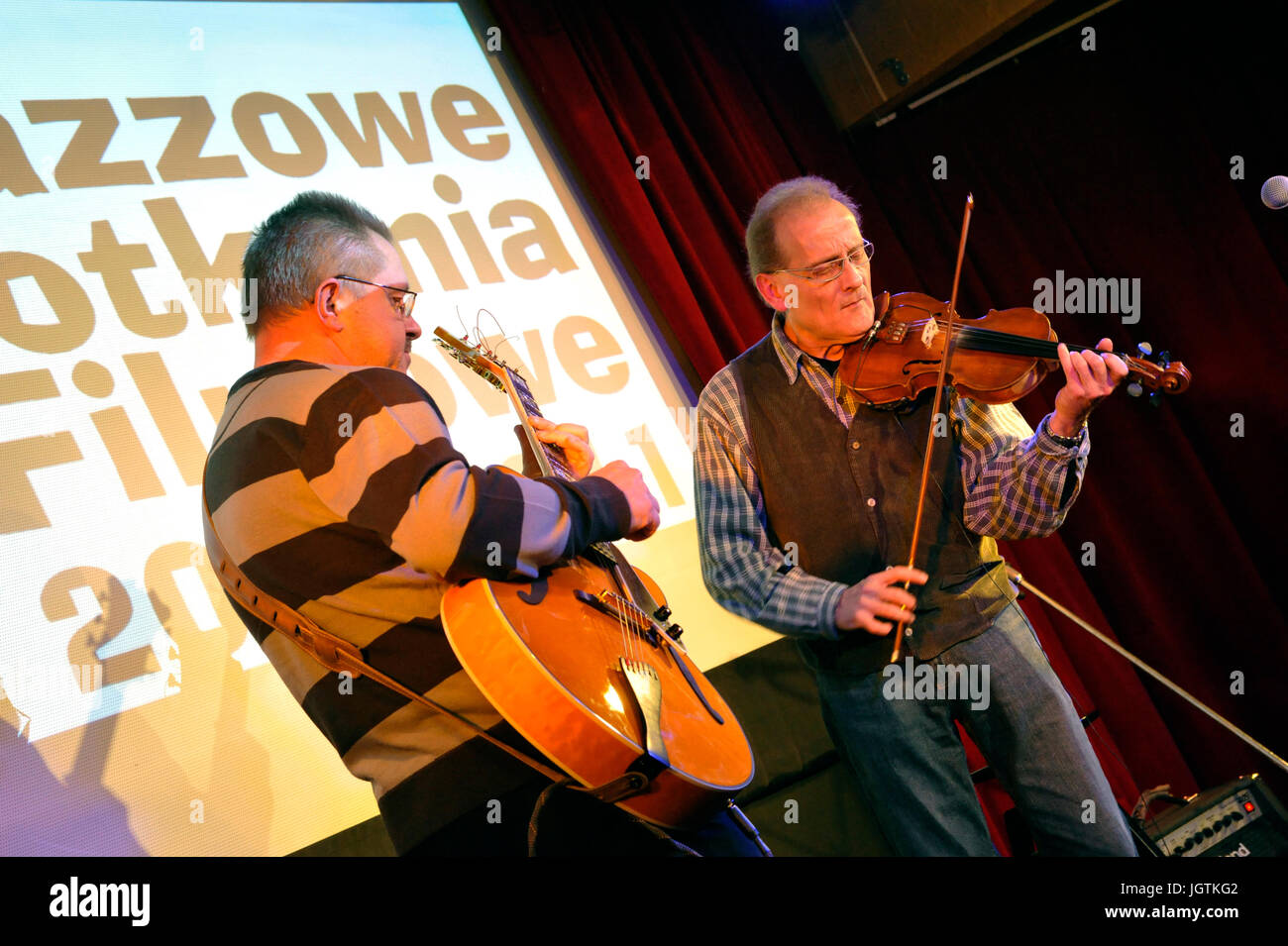 Jazz music performance on violin and guitar in a culture center in ...