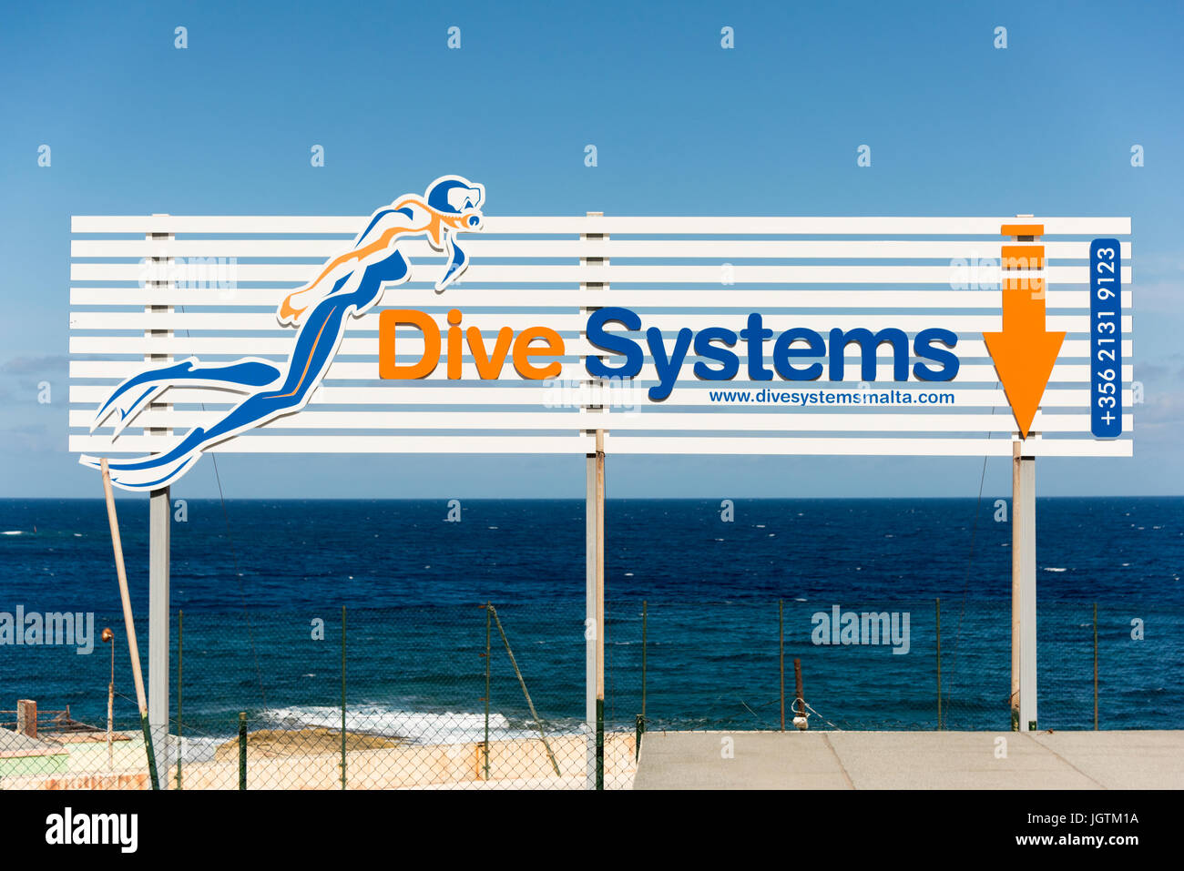 A large advertising sign for Dive Systems in St Julians Bay Malta, a ...
