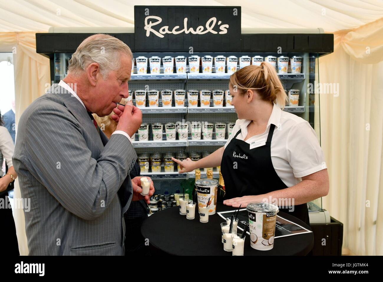 The Prince of Wales speaks to employee Rachel Brittain (right) and ...