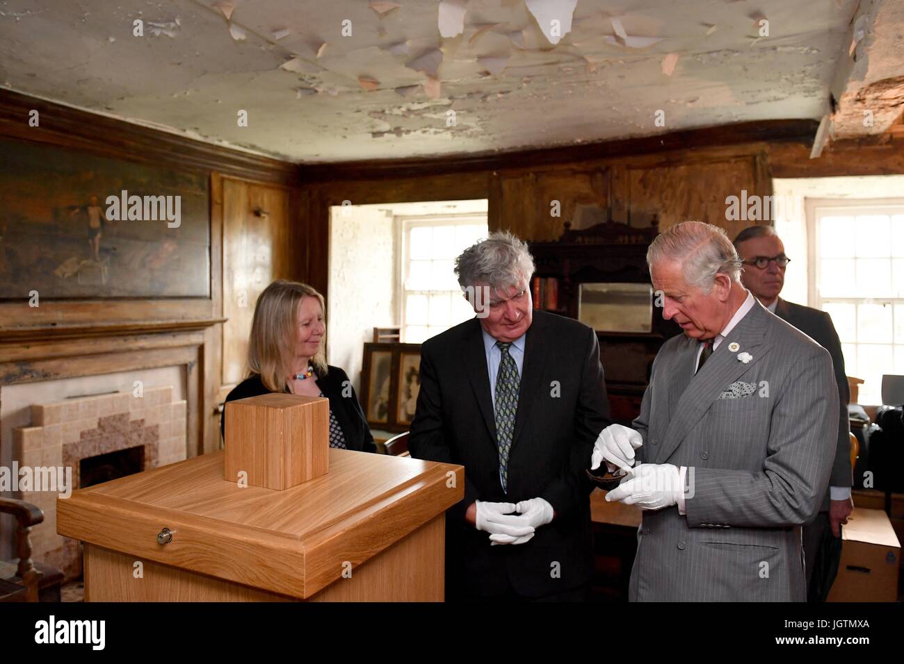 The Prince of Wales is joined by Professor David Austin (centre) as he ...