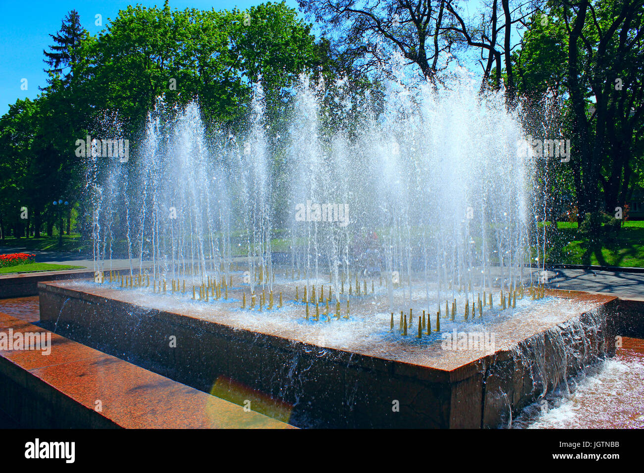 fountains in city park in hot summer day Stock Photo - Alamy