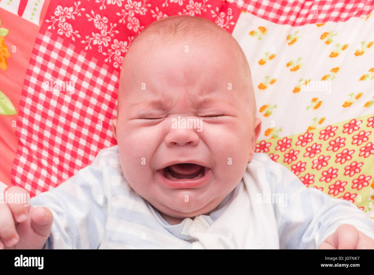 Portrait of a five-month crying boy Stock Photo - Alamy