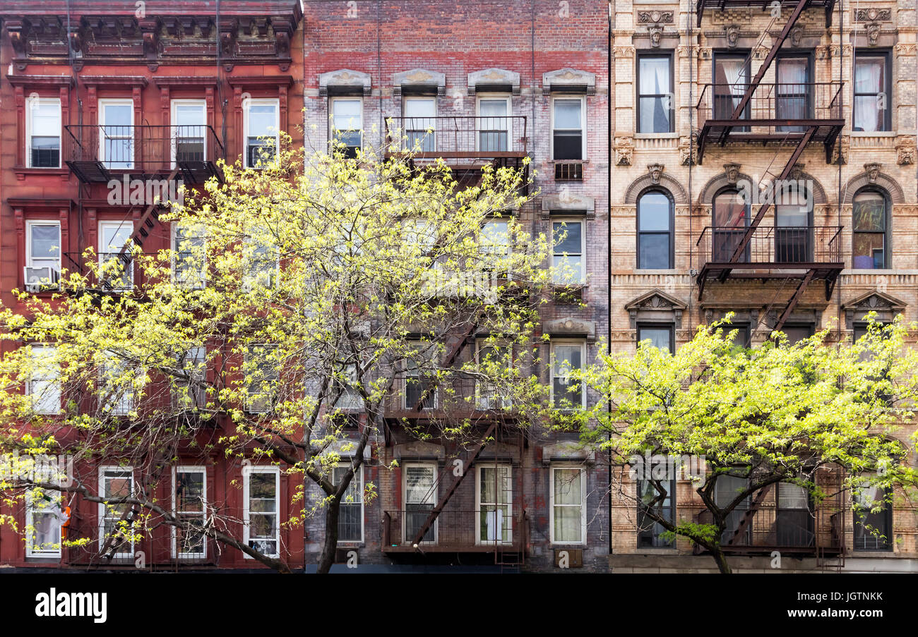 Historic old buildings and trees along 3rd Avenue in the East Village ...