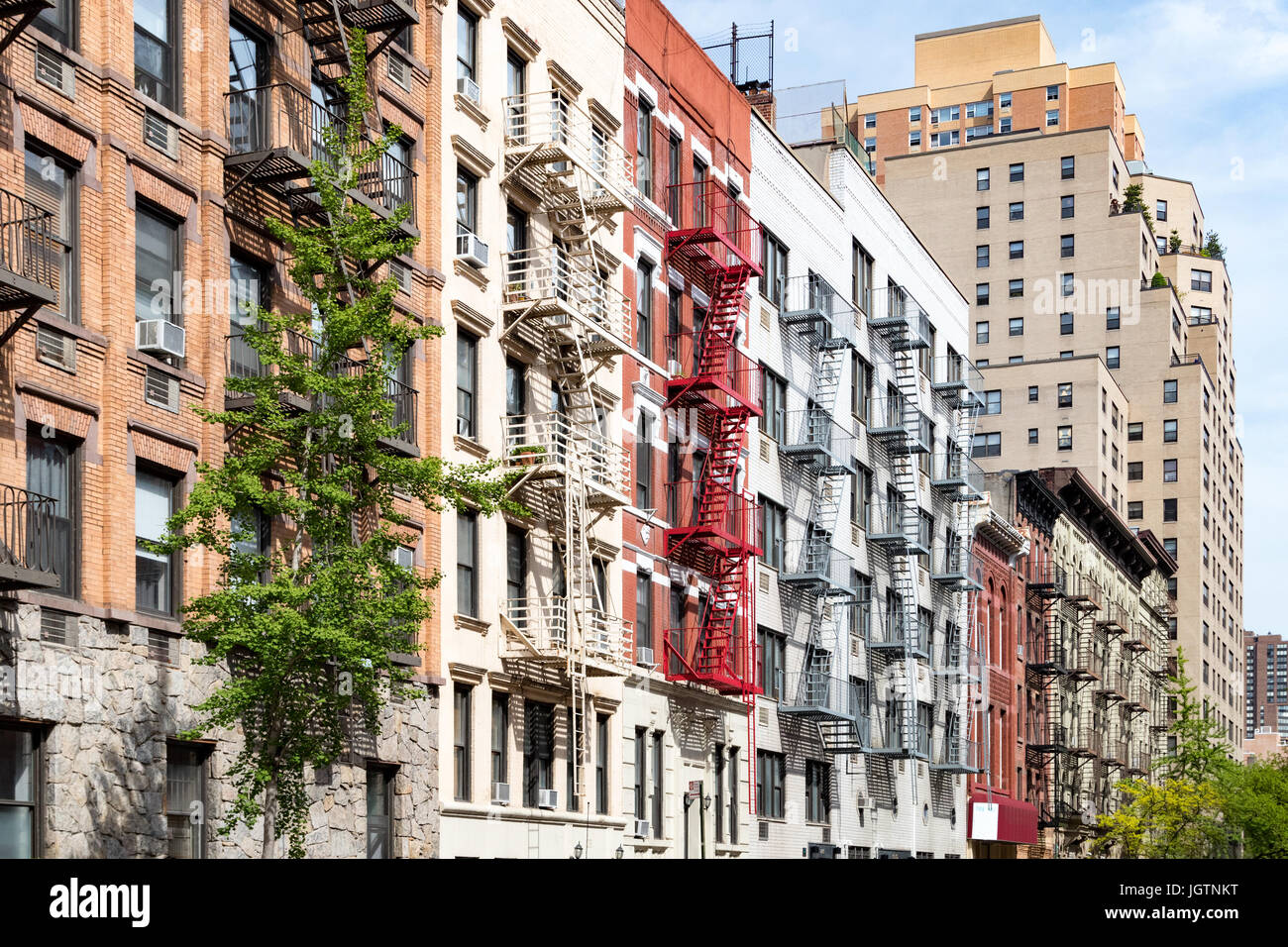 Block of colorful old apartment buildings in the East Village of ...