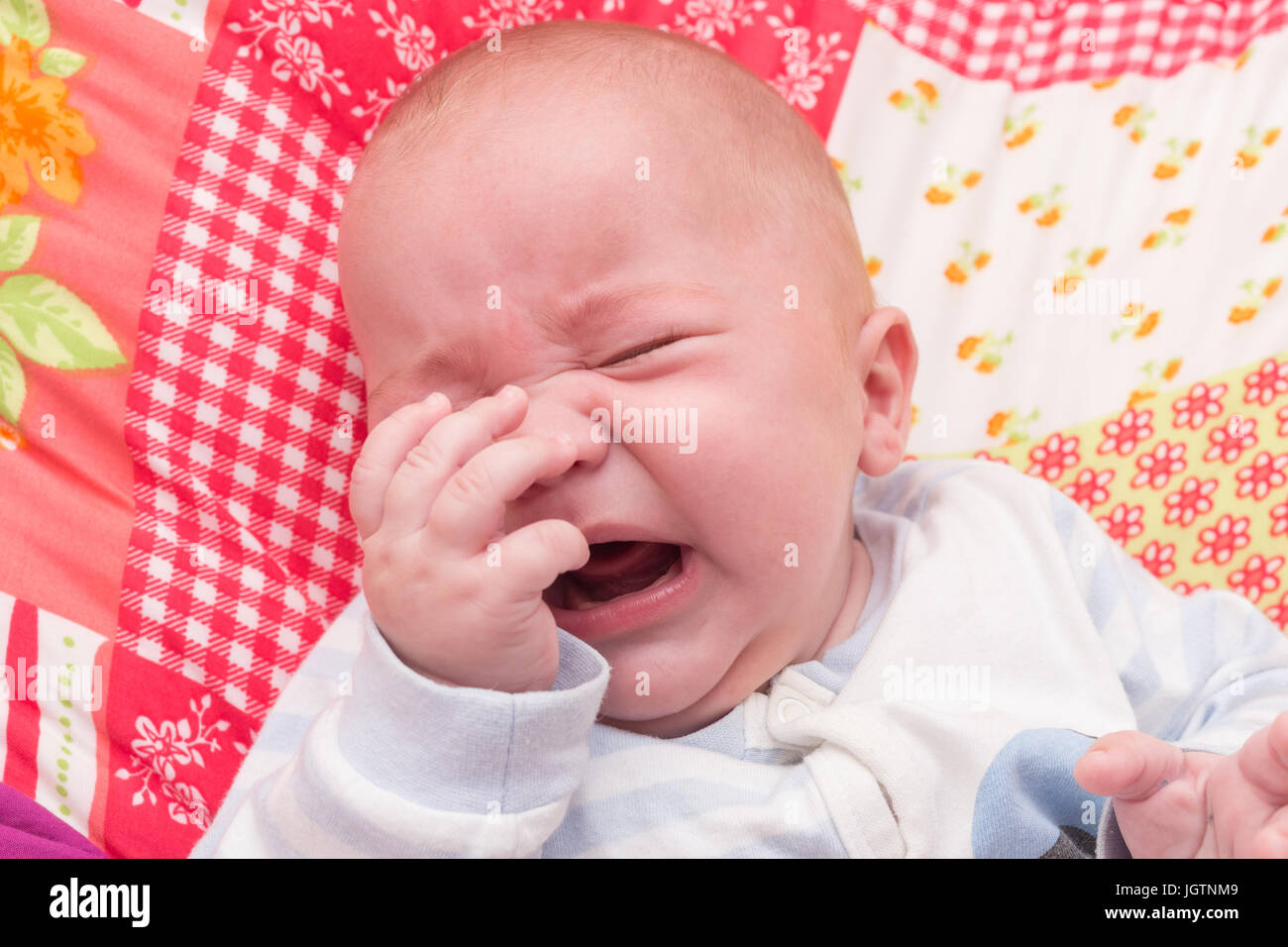 Portrait of a five-month crying boy Stock Photo - Alamy