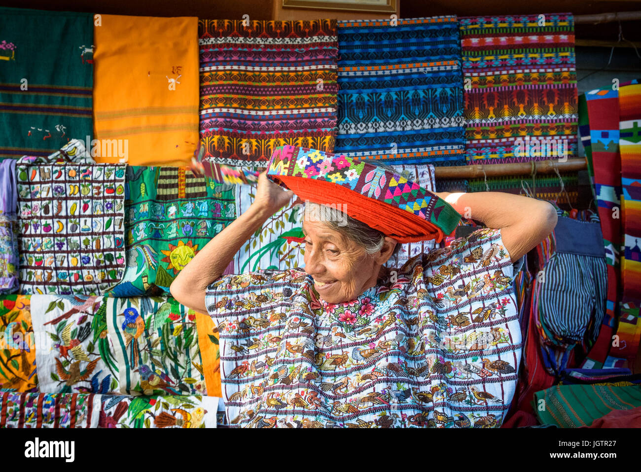 An older Indegenous Mayan woman wearing traditional dress, including a ...