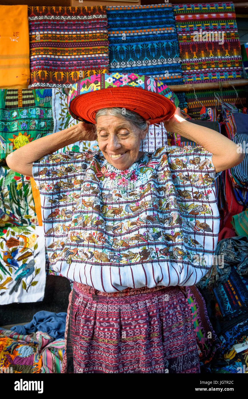An older Indegenous Mayan woman wearing traditional dress, including a ...