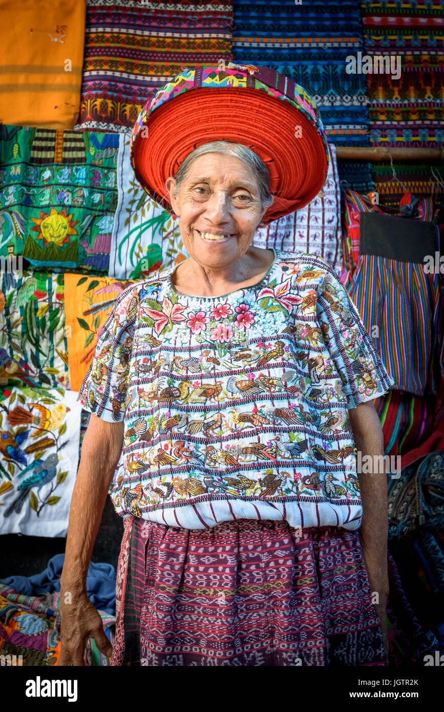 An older Indegenous Mayan woman wearing traditional dress, including a ...