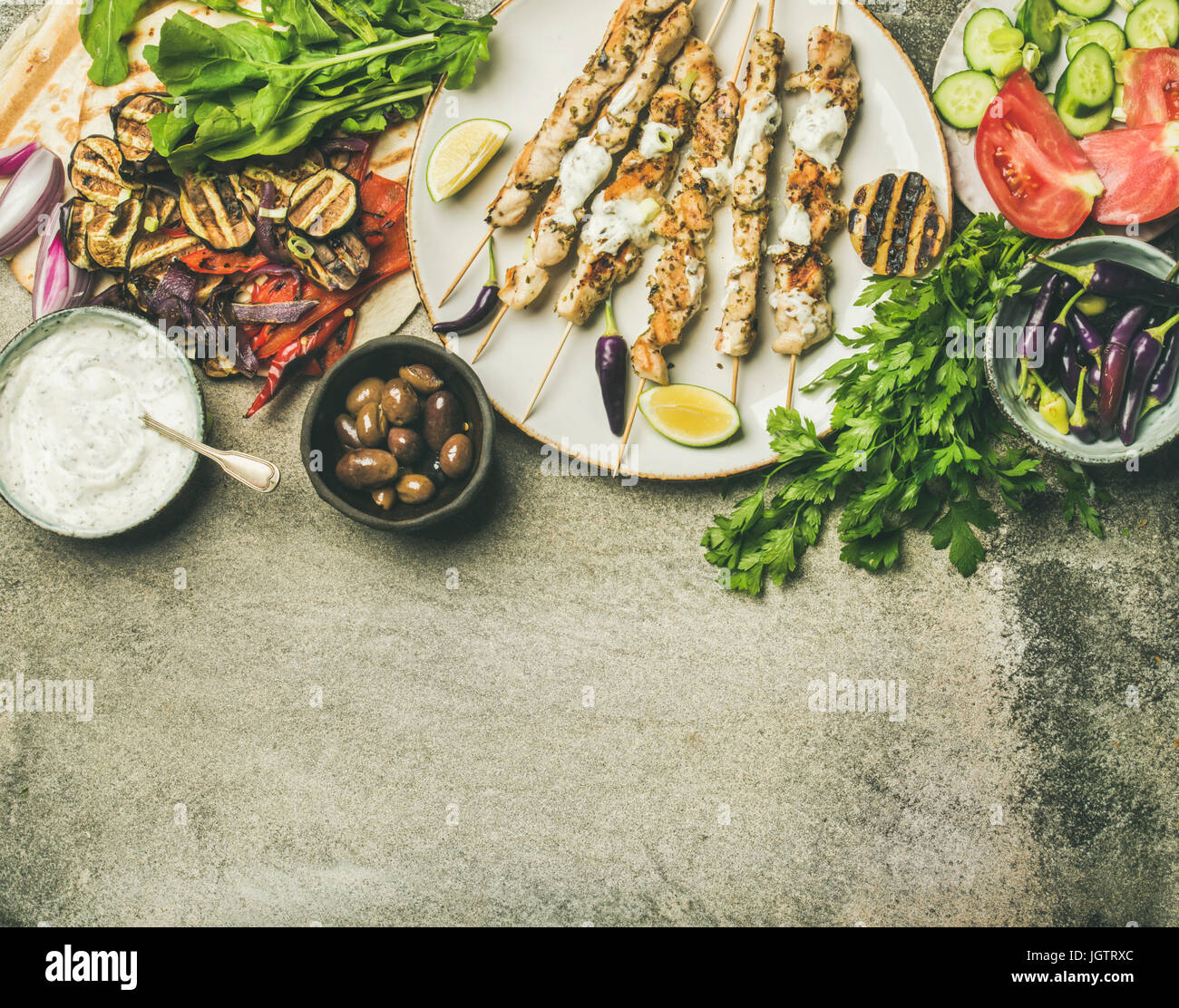 Summer barbecue party dinner set. Flatlay of grilled chicken skewers ...
