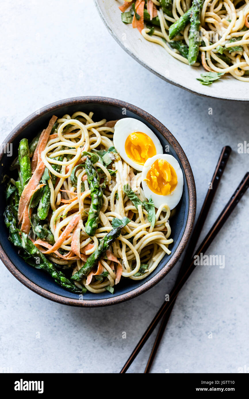 Asian spring vegetable noodles with soft egg Stock Photo - Alamy