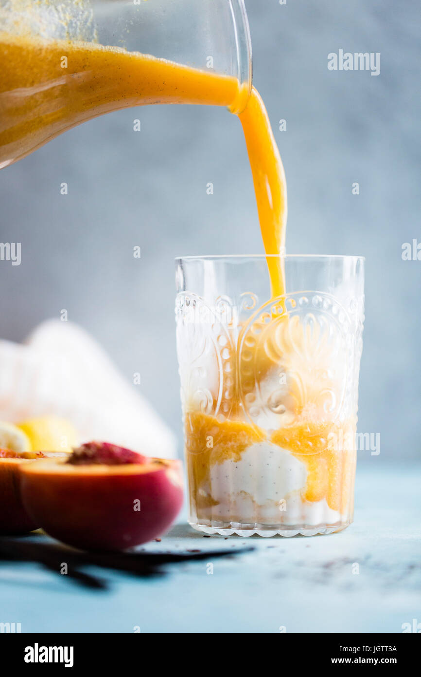 Bright and colorful Ice cream float. Fruit juice being poured Stock ...