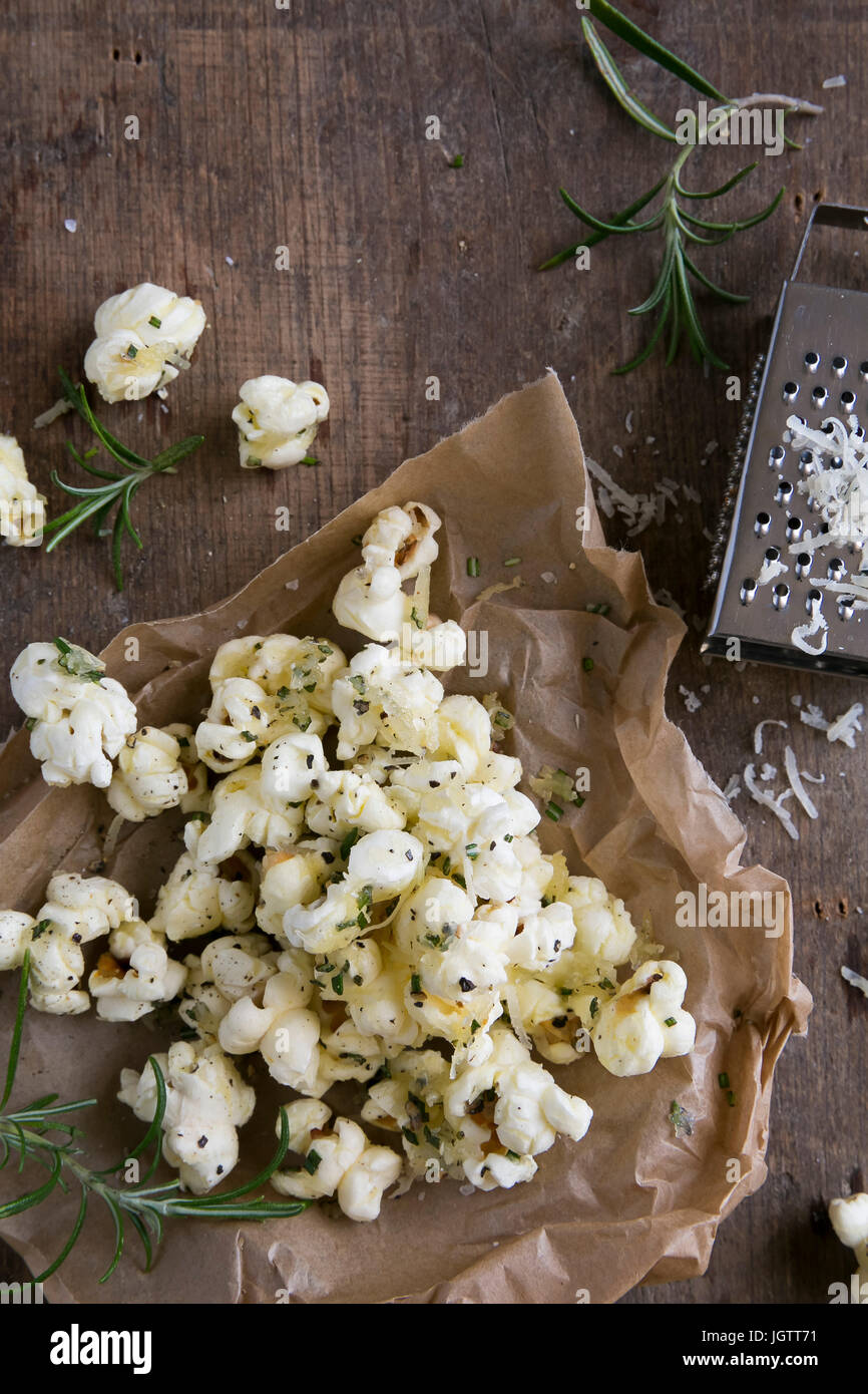 Savoury popcorn with herbs and melted cheese Stock Photo - Alamy