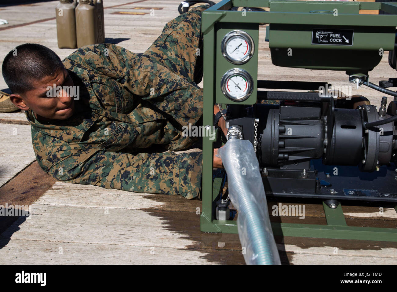 USNS SACAGAWEA— Lance Cpl. Ivan Gallardo performs an operation check on ...