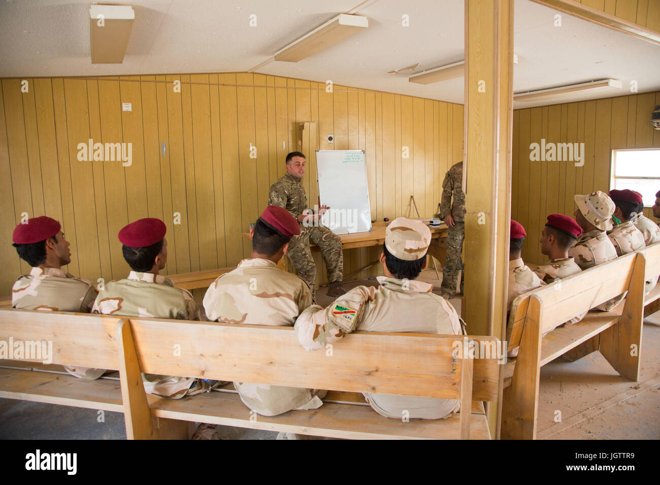 British trainer Sgt. Butch familiarizes Iraqi soldiers with different ...