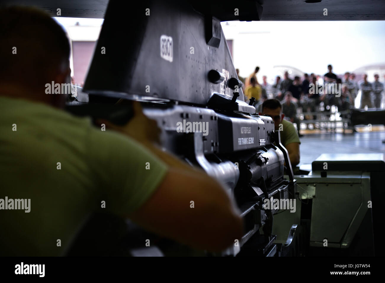 A load crew representing the 36th Aircraft Maintenance Unit loads a ...