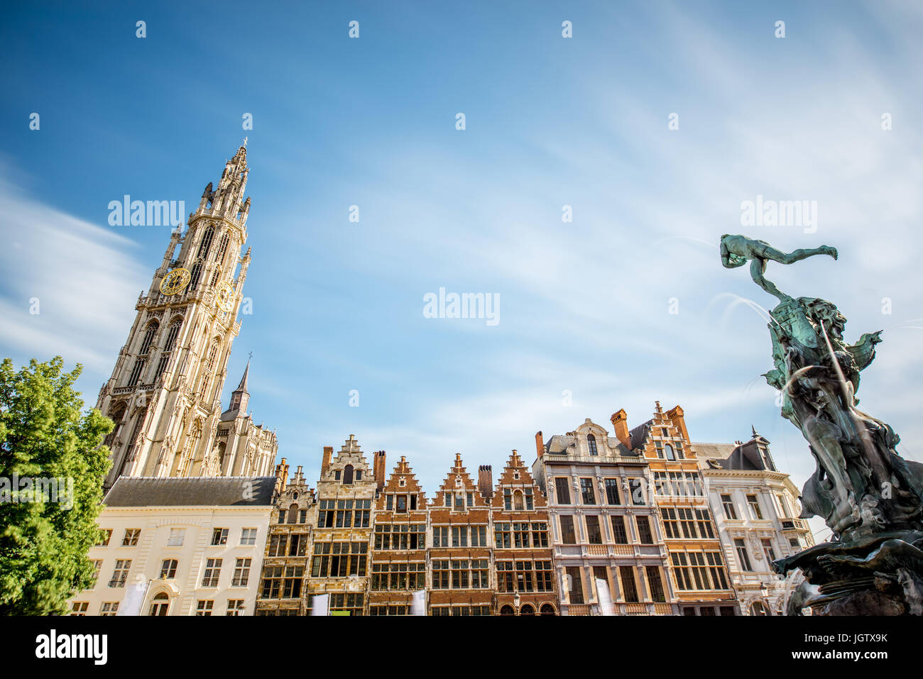 View on the beautiful buildings with fountain sculpture and church ...