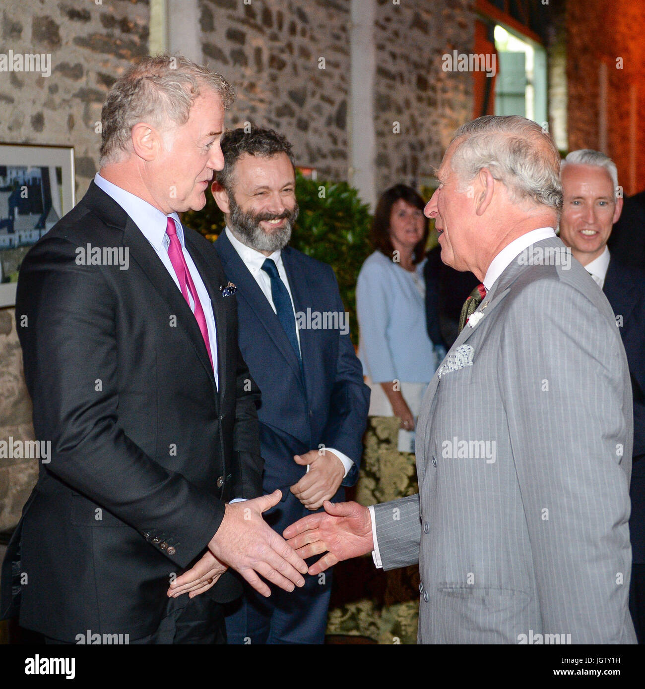 Owen Teale (left), and Michael Sheen greet the Prince of Wales at his ...