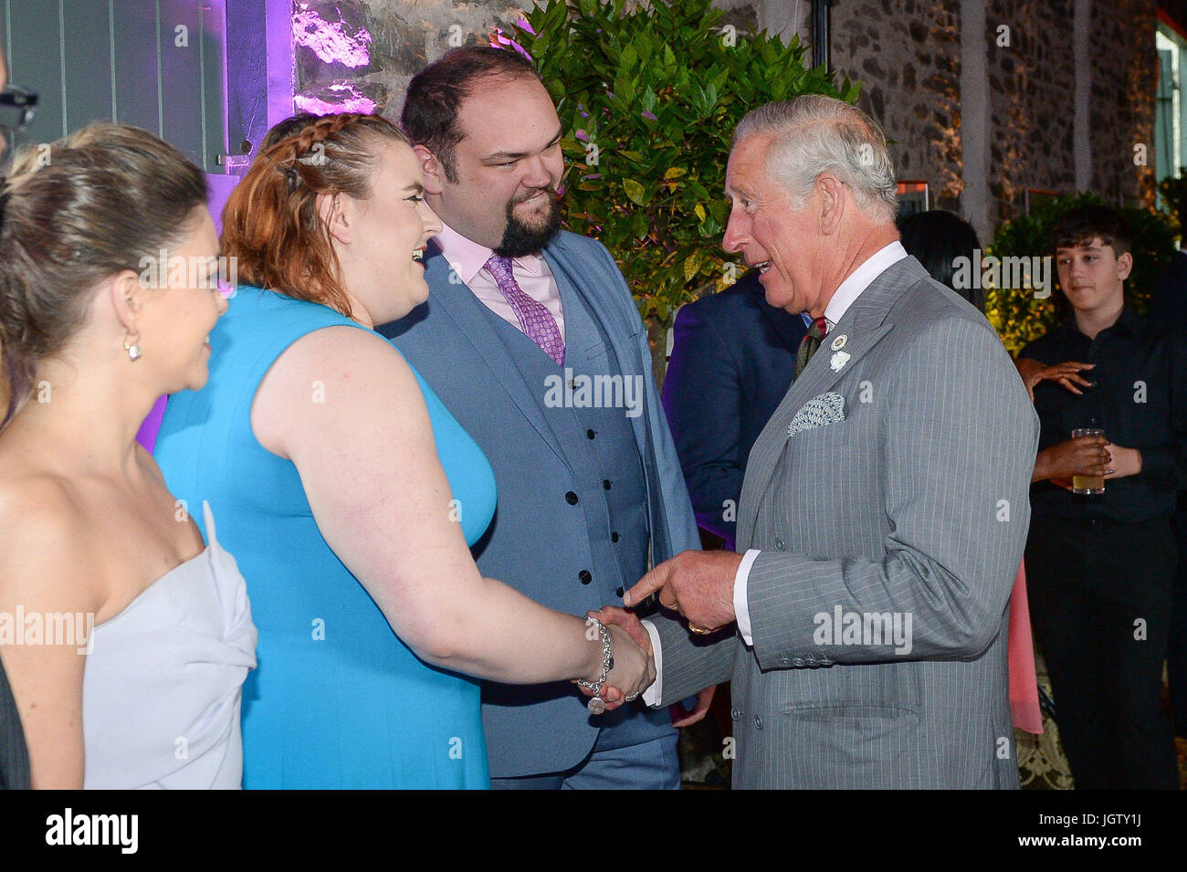 The Prince of Wales greets performer Becca Barrett at the barn where he ...