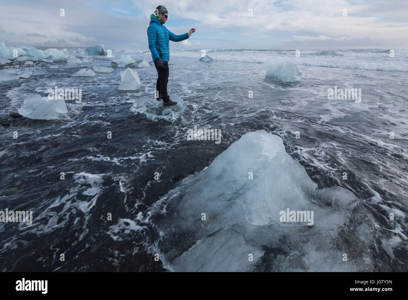 Man on ice in Iceland Stock Photo - Alamy