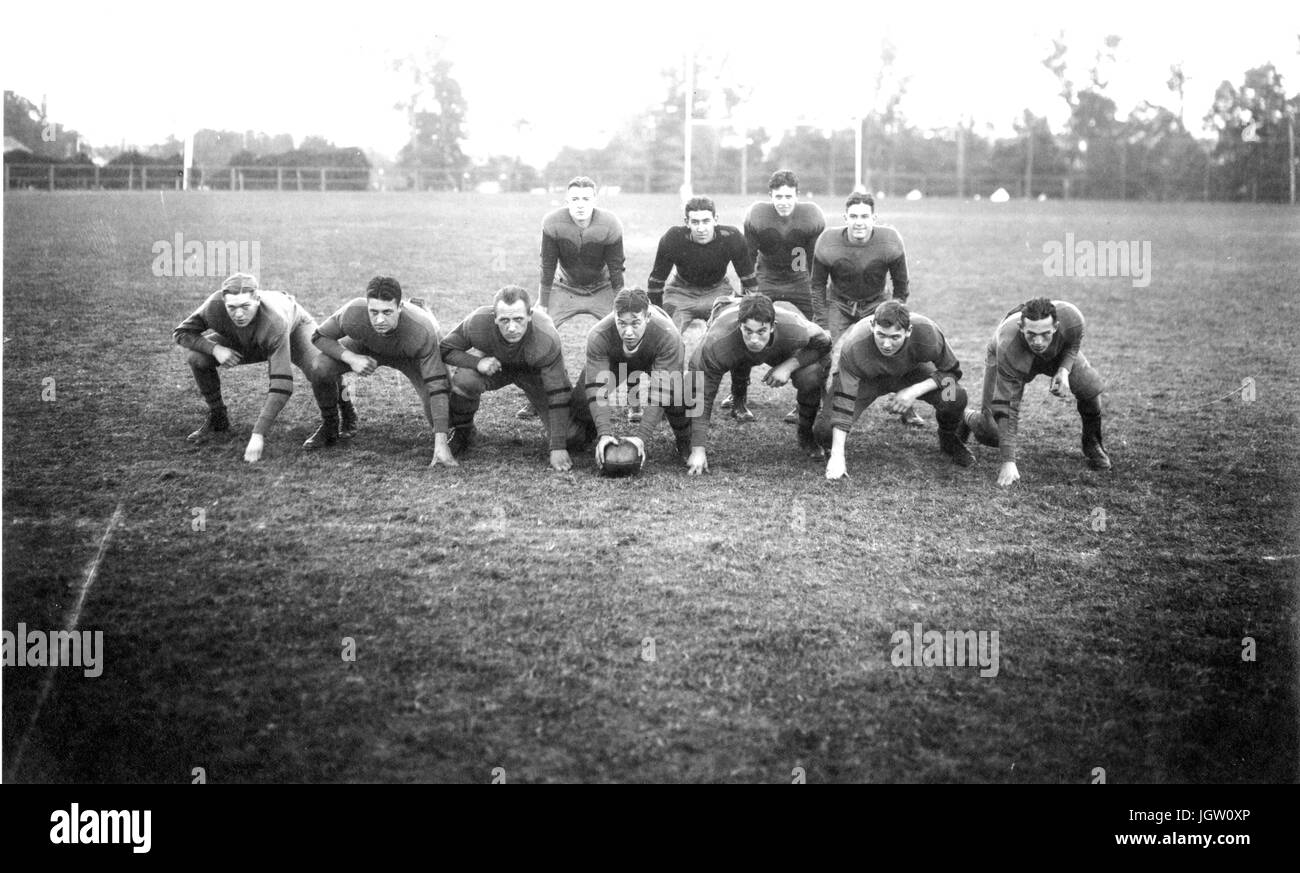Johns Hopkins University football team members pose in formation, in ...