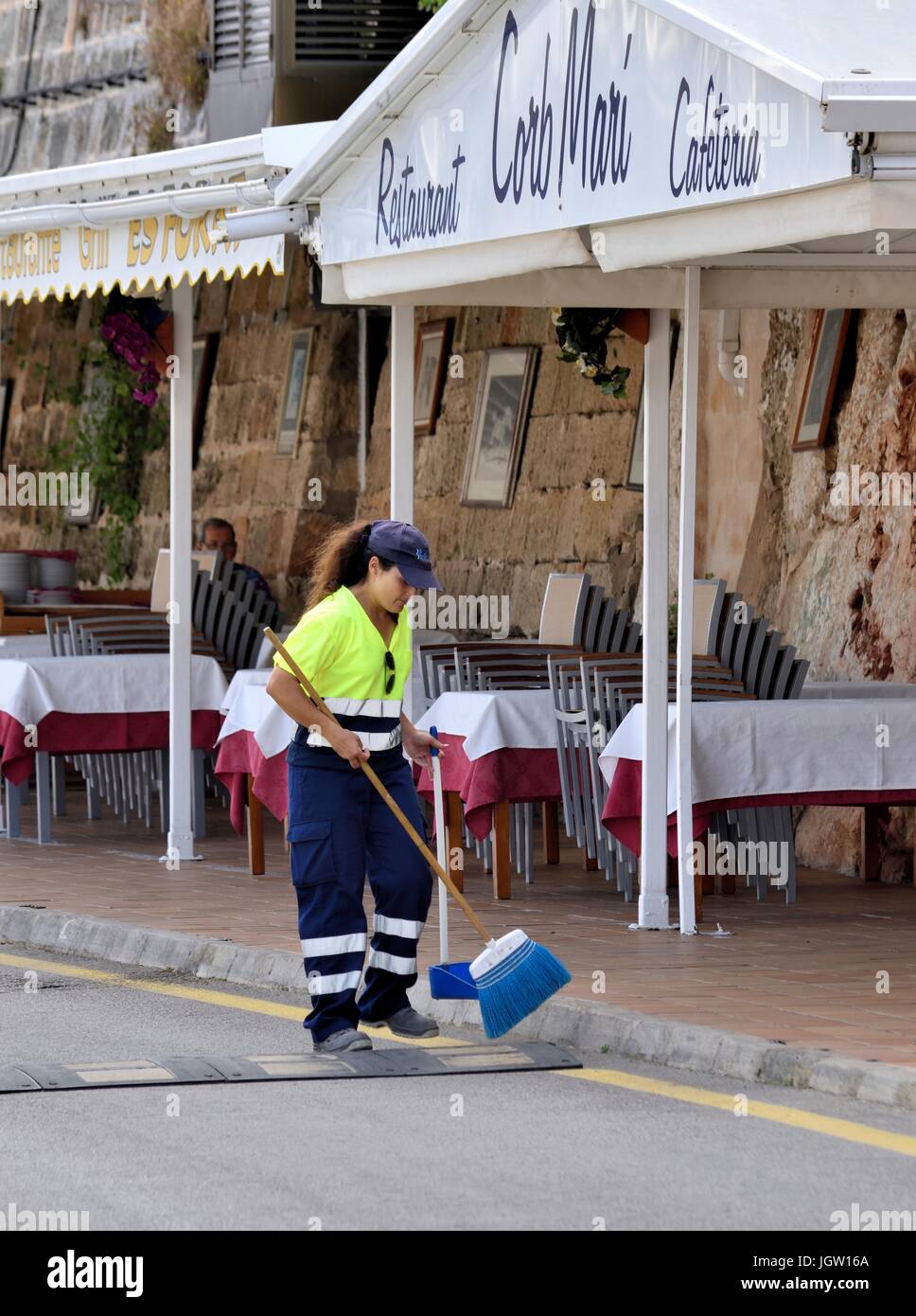 Woman sweeping street hi-res stock photography and images - Alamy