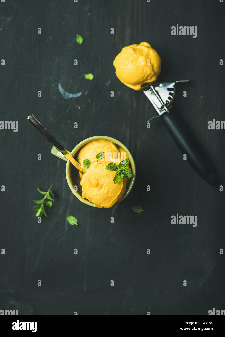 Mango sorbet ice cream scoops with mint, copy space Stock Photo - Alamy