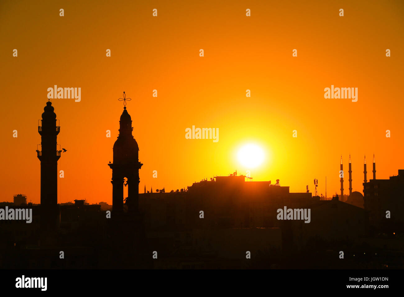 minaret and bell tower together, interfaith tolerance Stock Photo - Alamy
