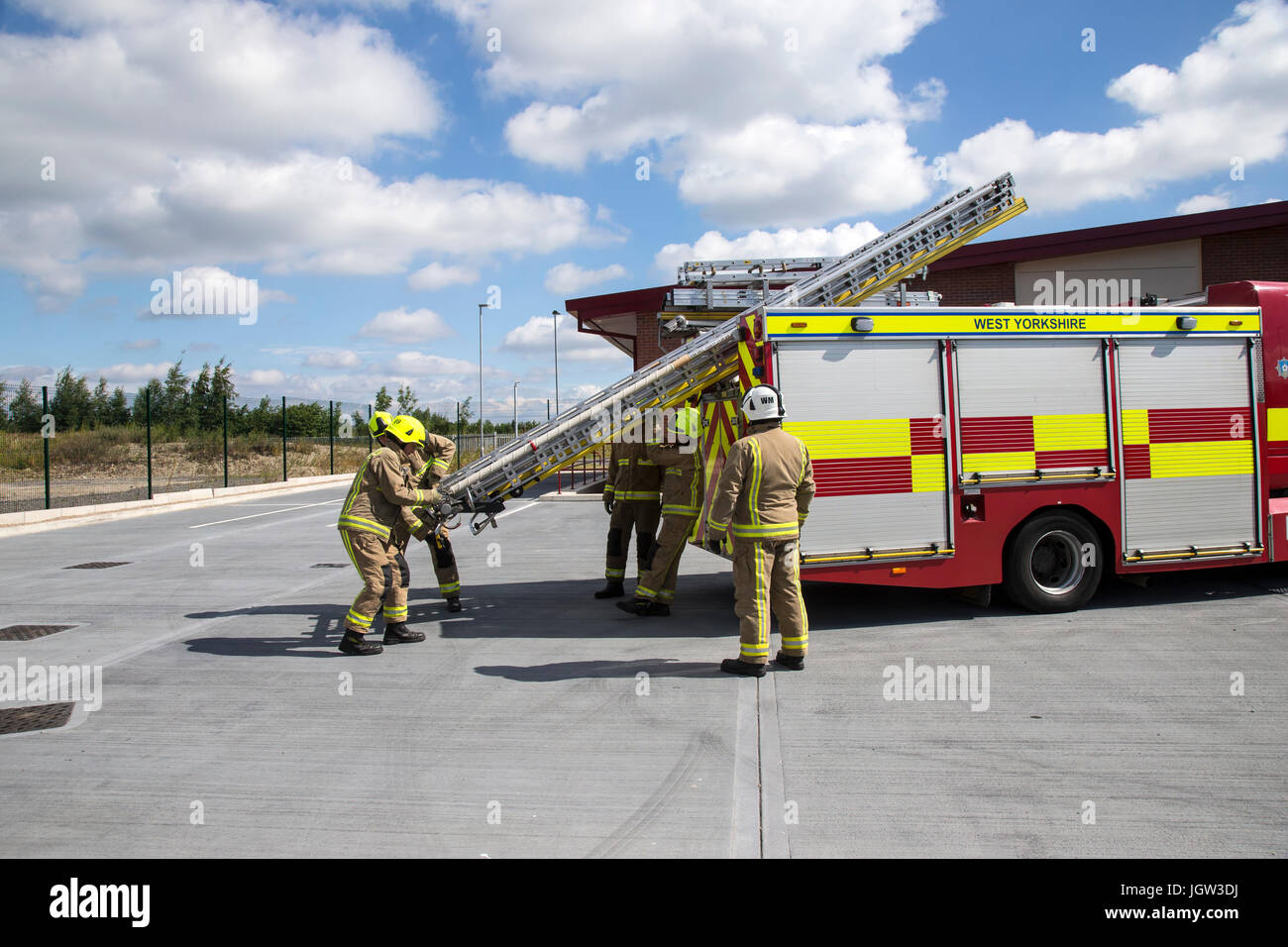 Firemen using ground ladders hi-res stock photography and images - Alamy