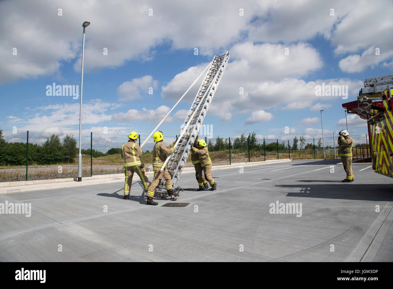 Firemen using ground ladders hi-res stock photography and images - Alamy