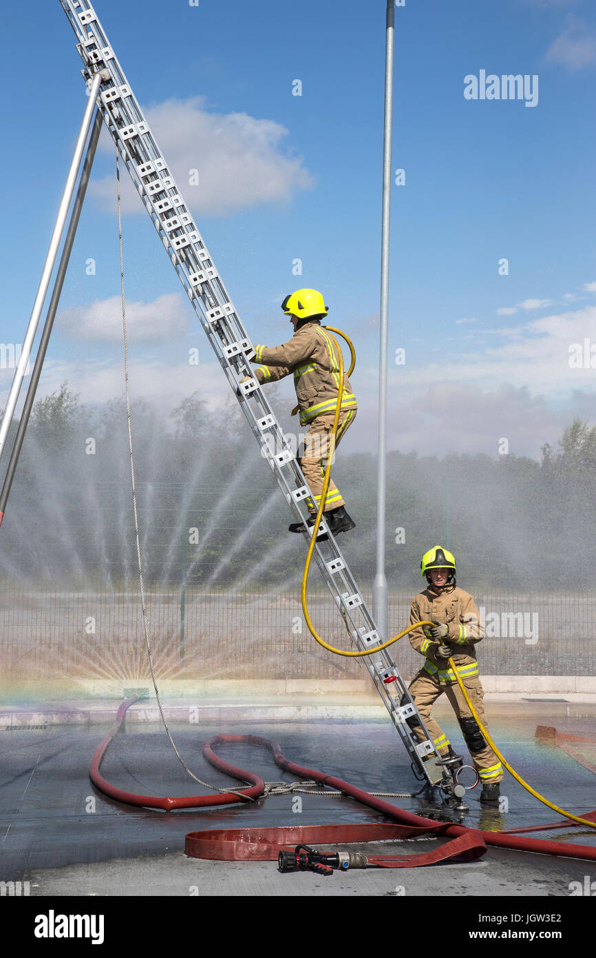 Using ladders hi-res stock photography and images - Alamy