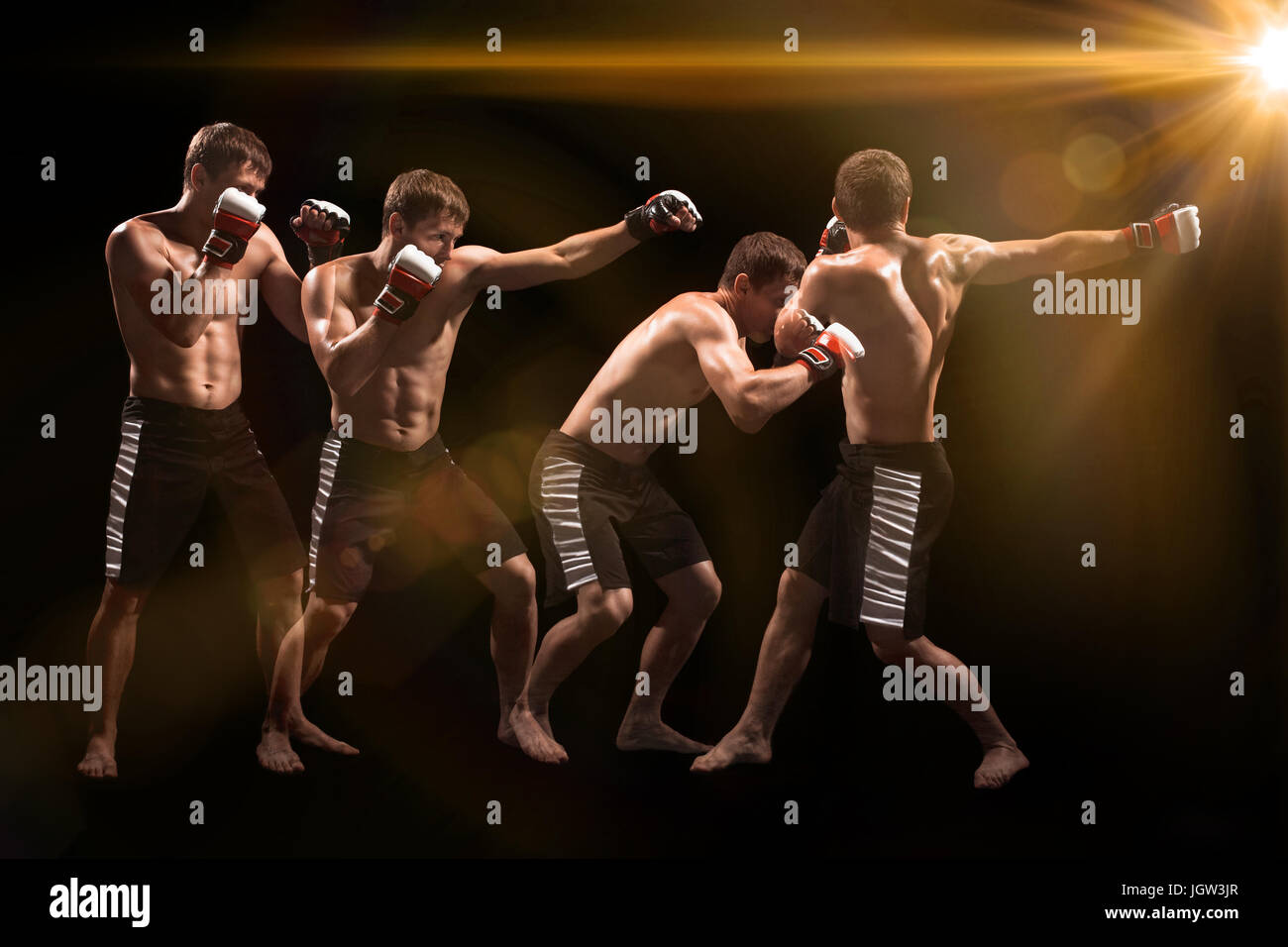 Male boxer boxing in punching bag with dramatic edgy lighting in a dark ...