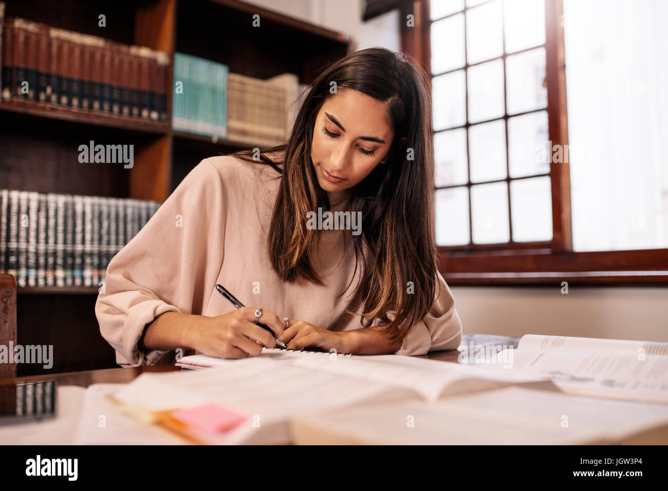 Making notes in library hi-res stock photography and images - Alamy