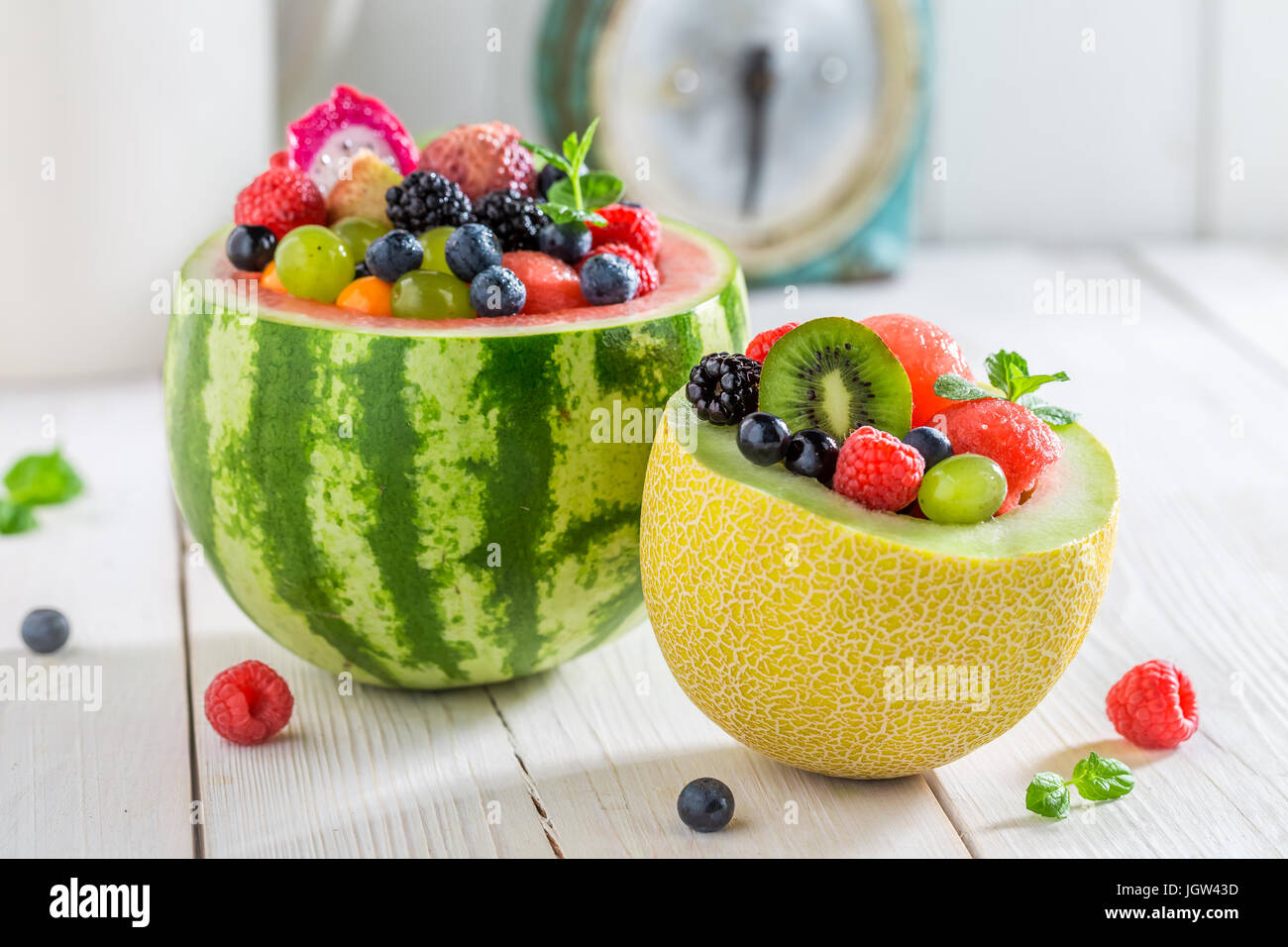 Fruits salad in watermelon and melon with berry fruits Stock Photo - Alamy