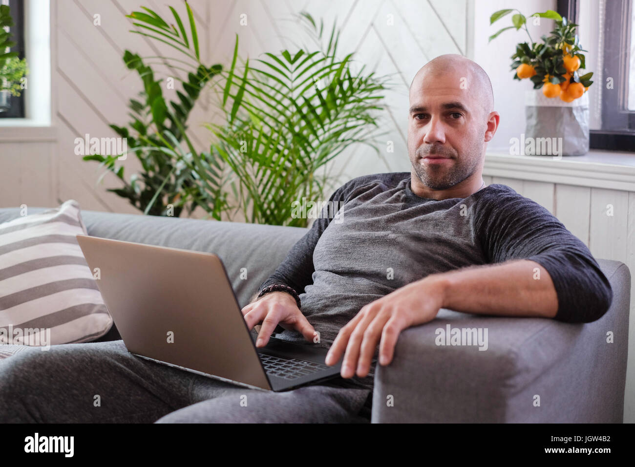 Lifestyle. Handsome man at home Stock Photo - Alamy