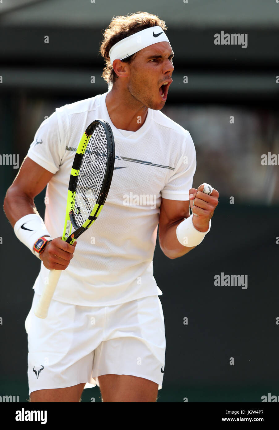 Rafael Nadal reacts during his match against Gilles Muller on day seven ...
