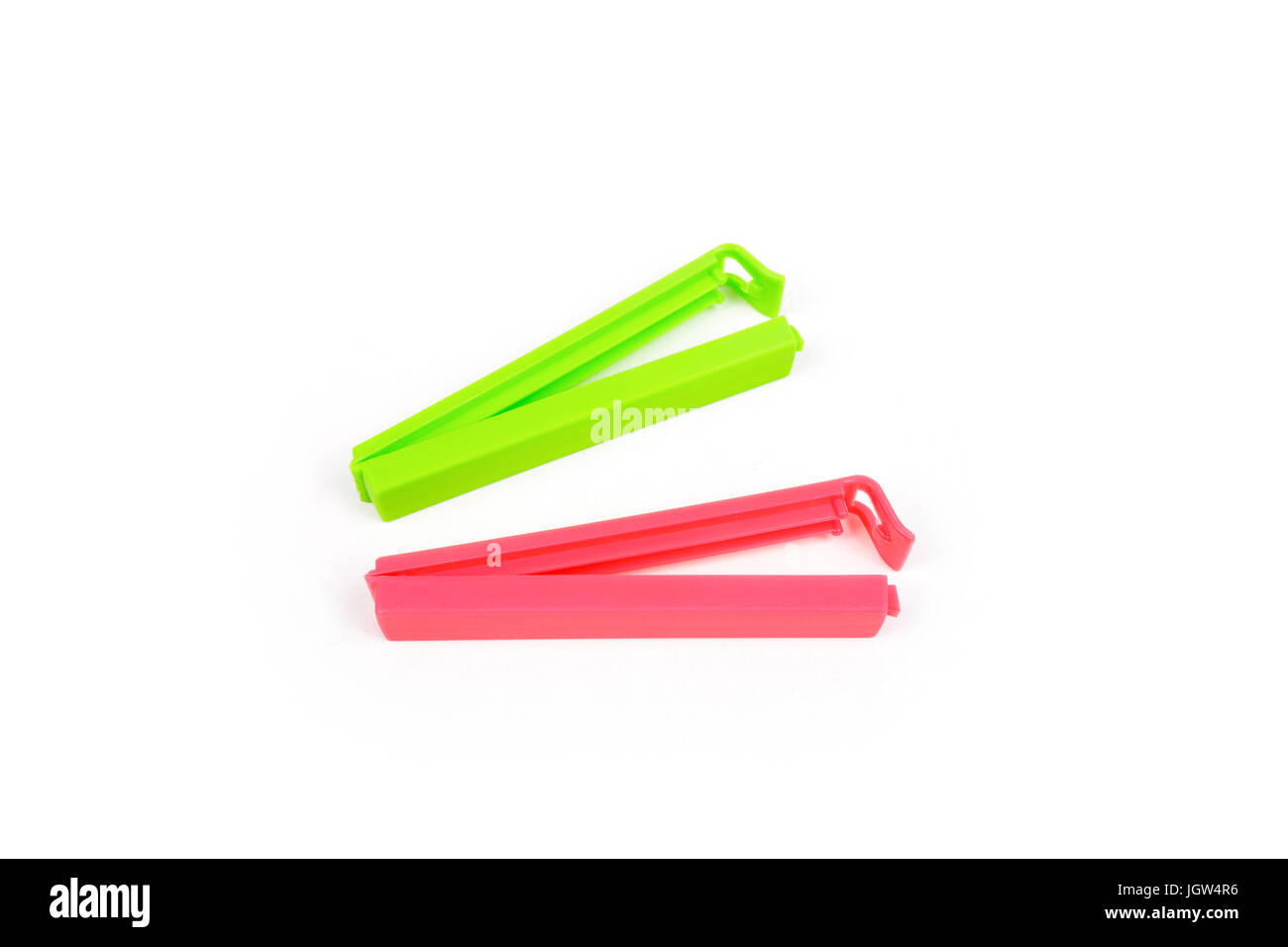 Colorful bag clips on white background Stock Photo - Alamy