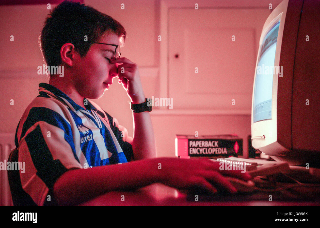 Young boy aged 12 staying up late on his computer Stock Photo - Alamy