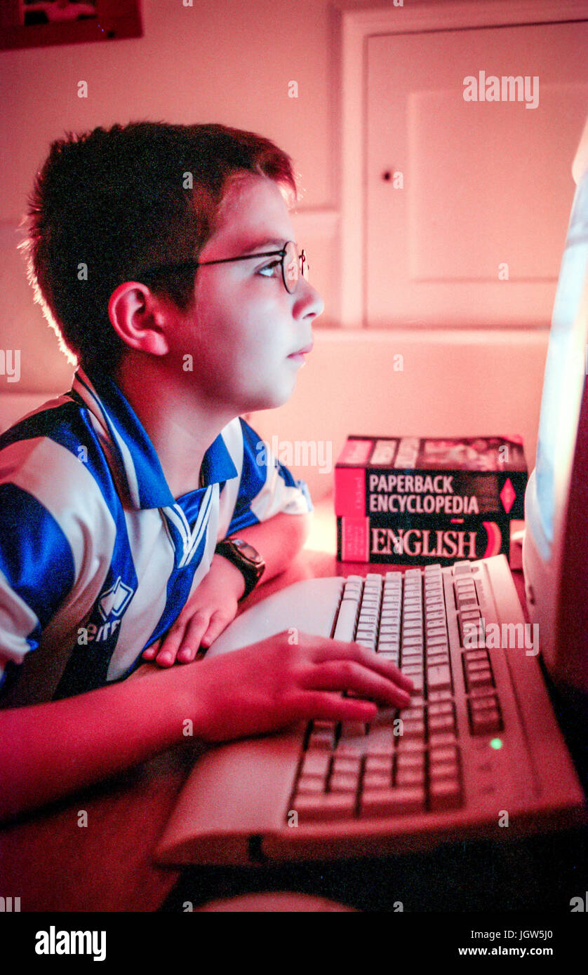 Young boy aged 12 staying up late on his computer Stock Photo - Alamy
