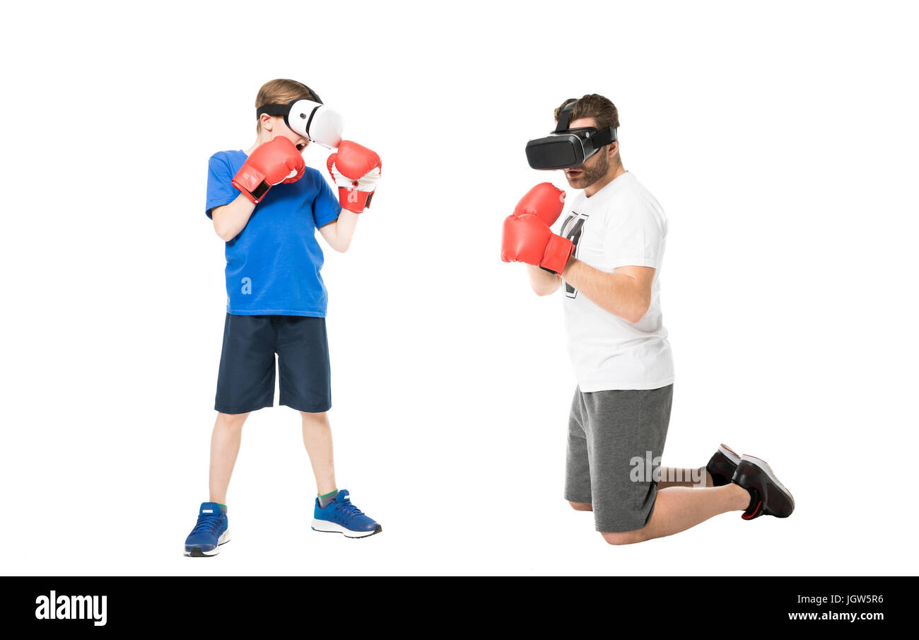 side view of father and son boxing in virtual reality headsets isolated ...