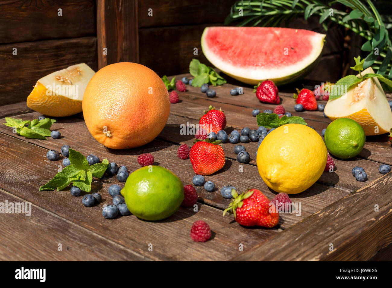 Fruits and berries on the white wooden table, top view Stock Photo - Alamy