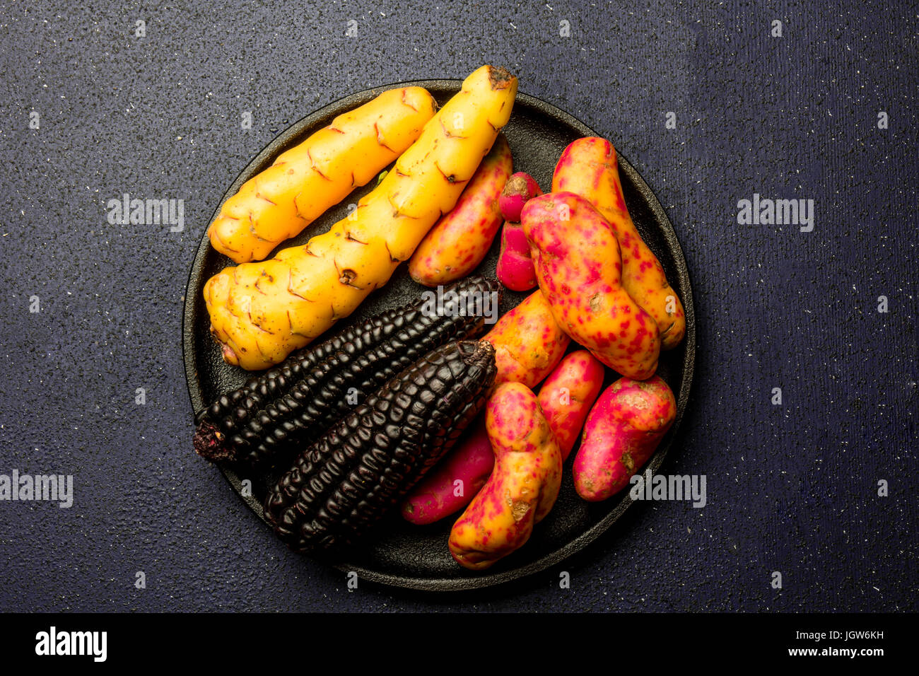 Peruvian raw ingredients for cooking black corn and sweet potatoes. Top ...