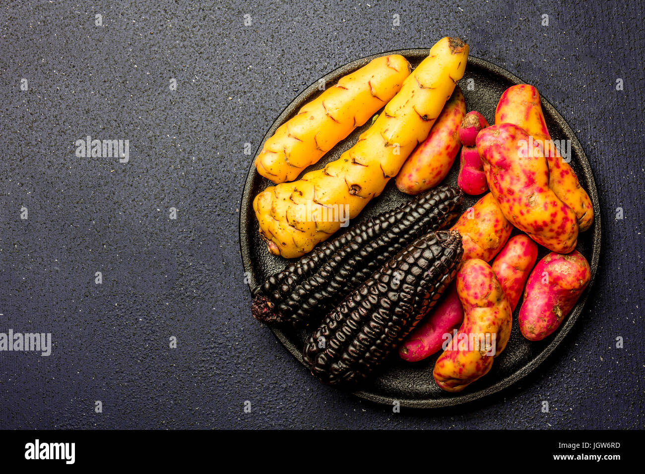 Peruvian raw ingredients for cooking black corn and sweet potatoes. Top ...